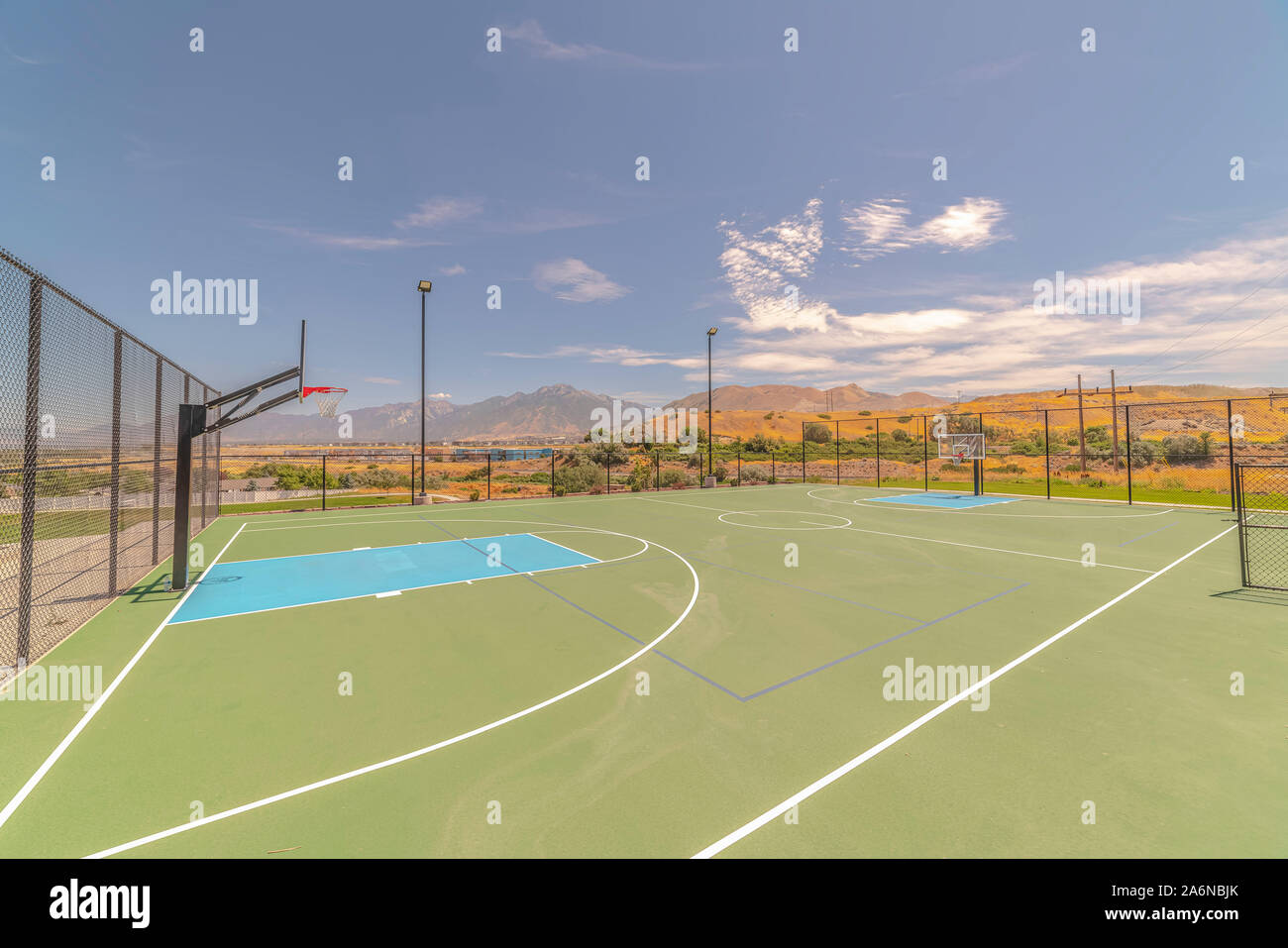 Outdoor turf basketball court on sunny, clear day Stock Photo - Alamy