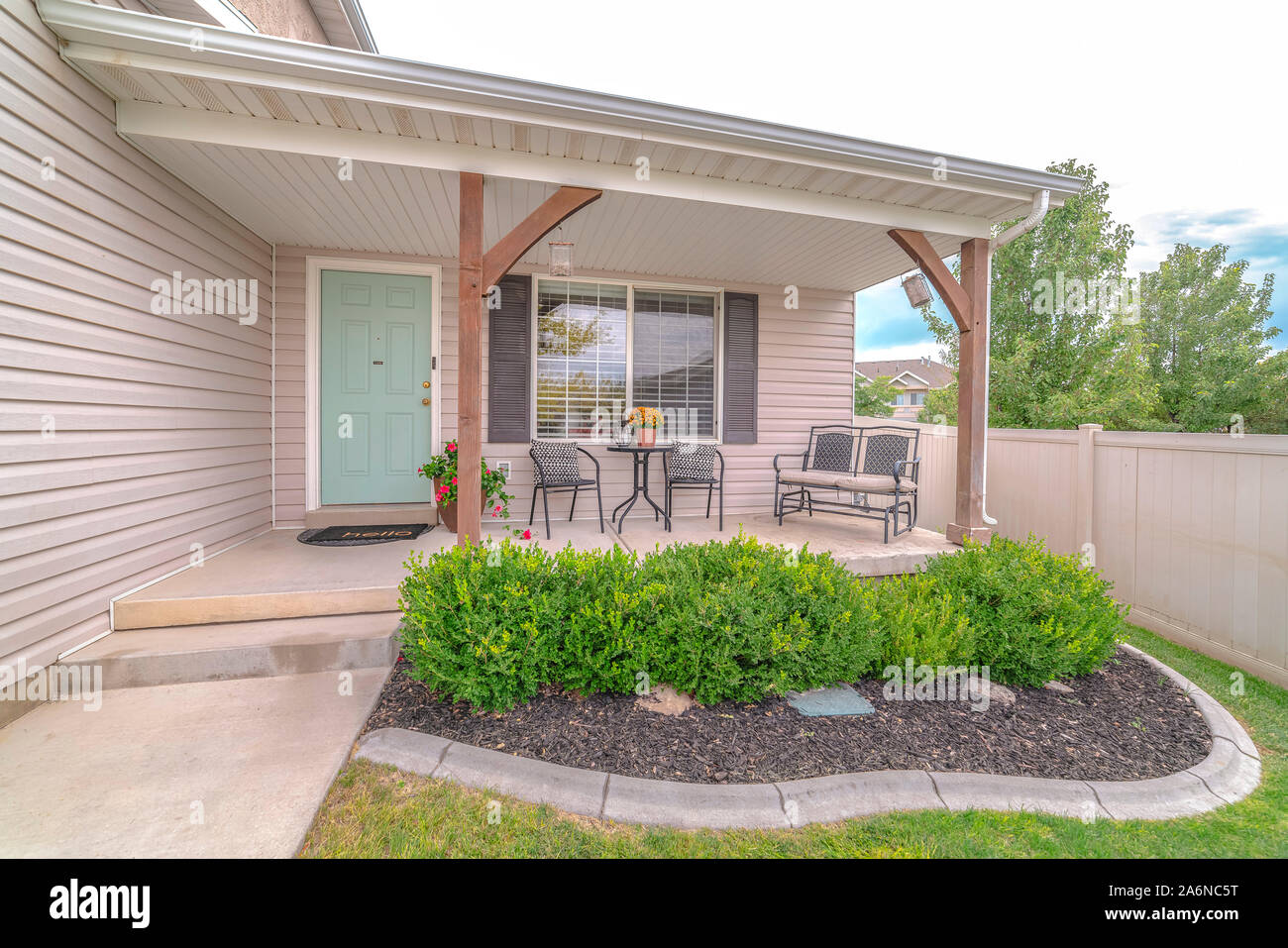 Front veranda of modern home and landscaped garden Stock Photo - Alamy