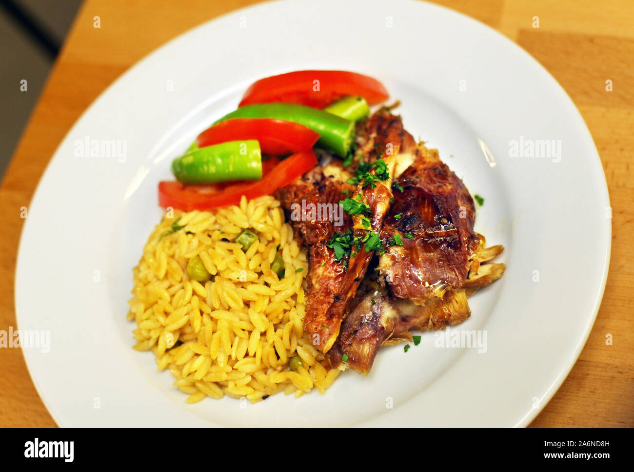 Grilled lamp meat with vegetables and rice on the dinner plate Stock ...