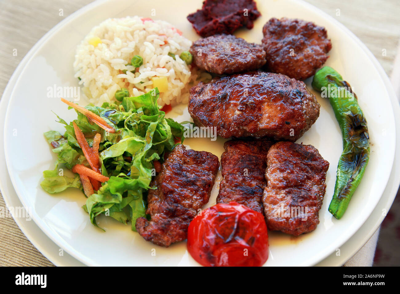 Meatballs with rice and vegetables on the dinner plate Stock Photo - Alamy