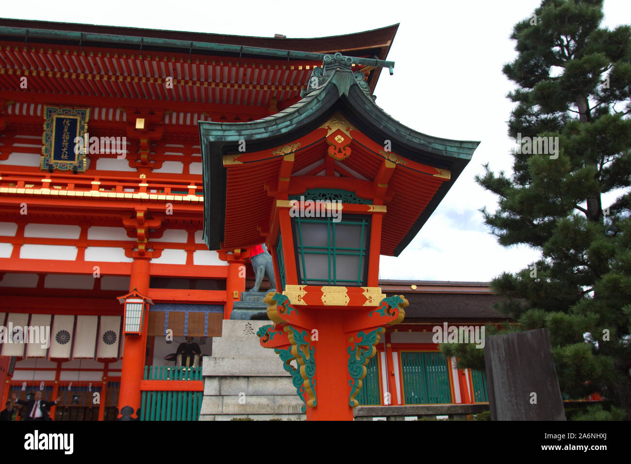 Ornate lamp in front of the Two-Storeyed Gate at Fushimi Inari Taisha ...