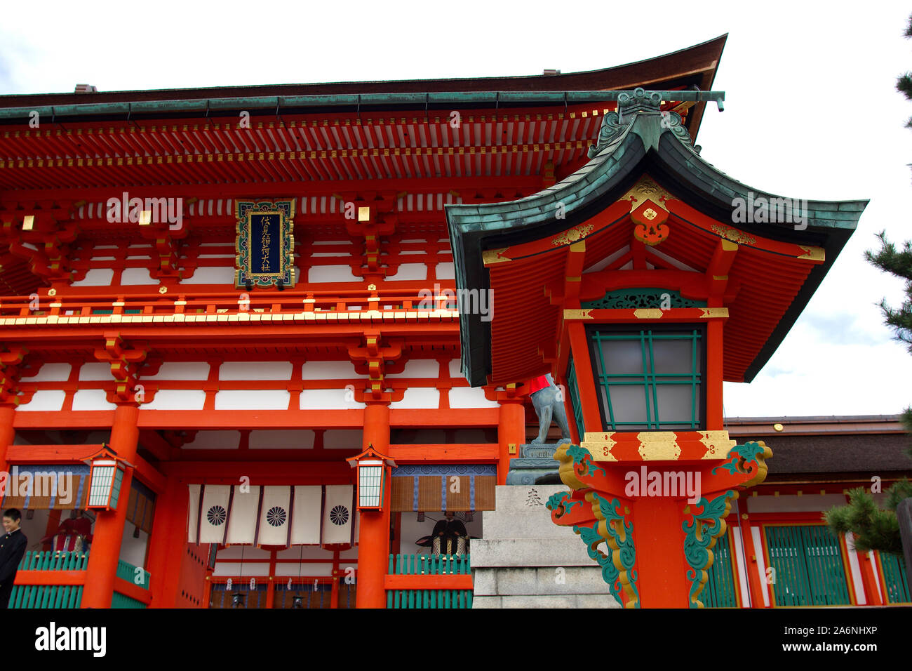 Ornate lamp in front of the Two-Storeyed Gate at Fushimi Inari Taisha ...