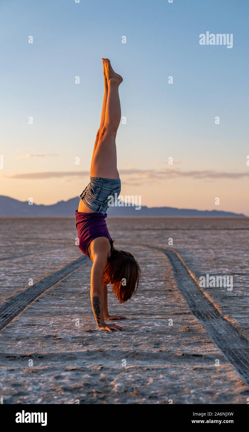 Beautiful Woman Doing Handstands During Sunset in Bonneville Salt flats ...