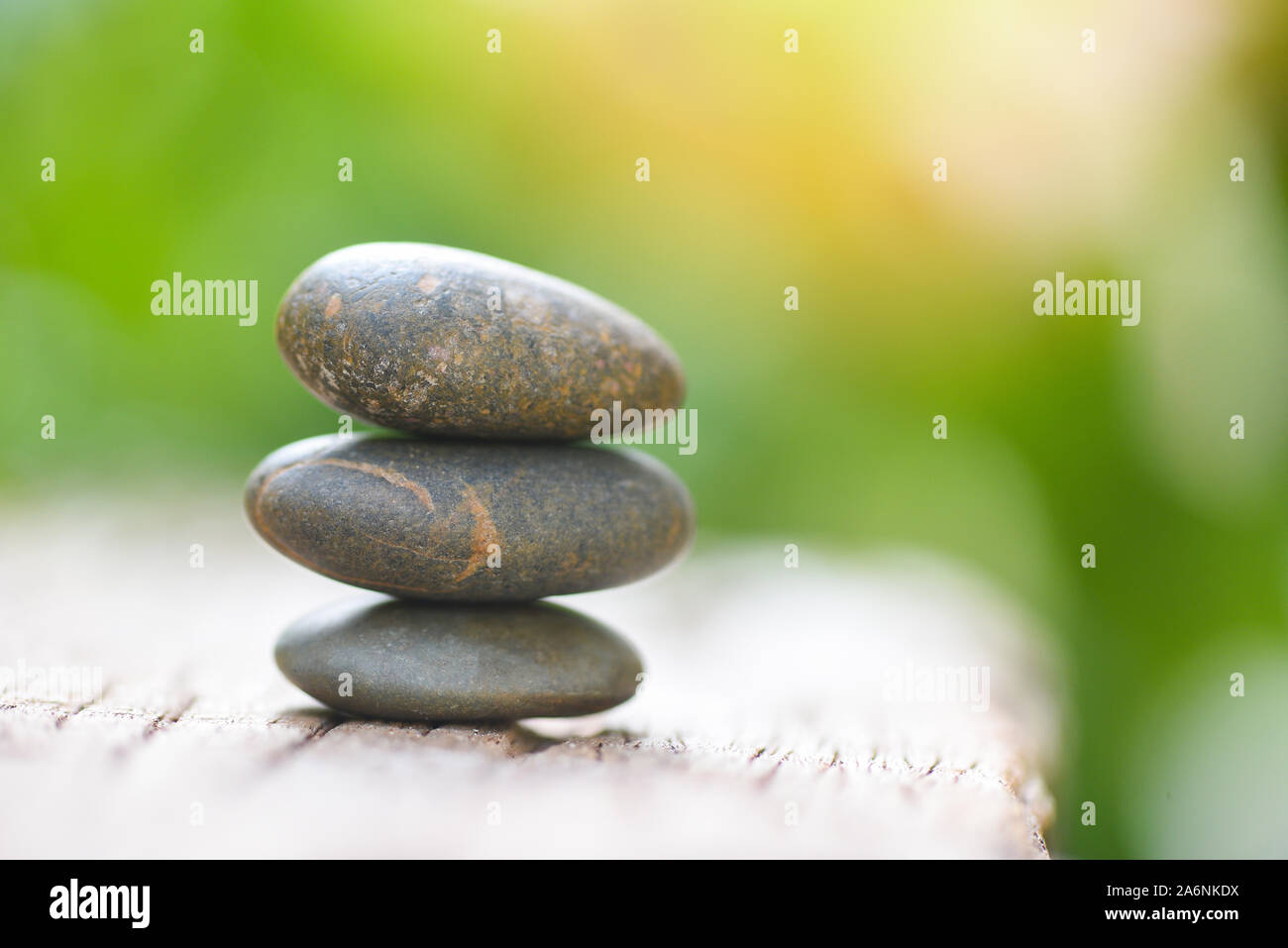 Natural wellness concept / Relax zen stones stack on wooden nature ...