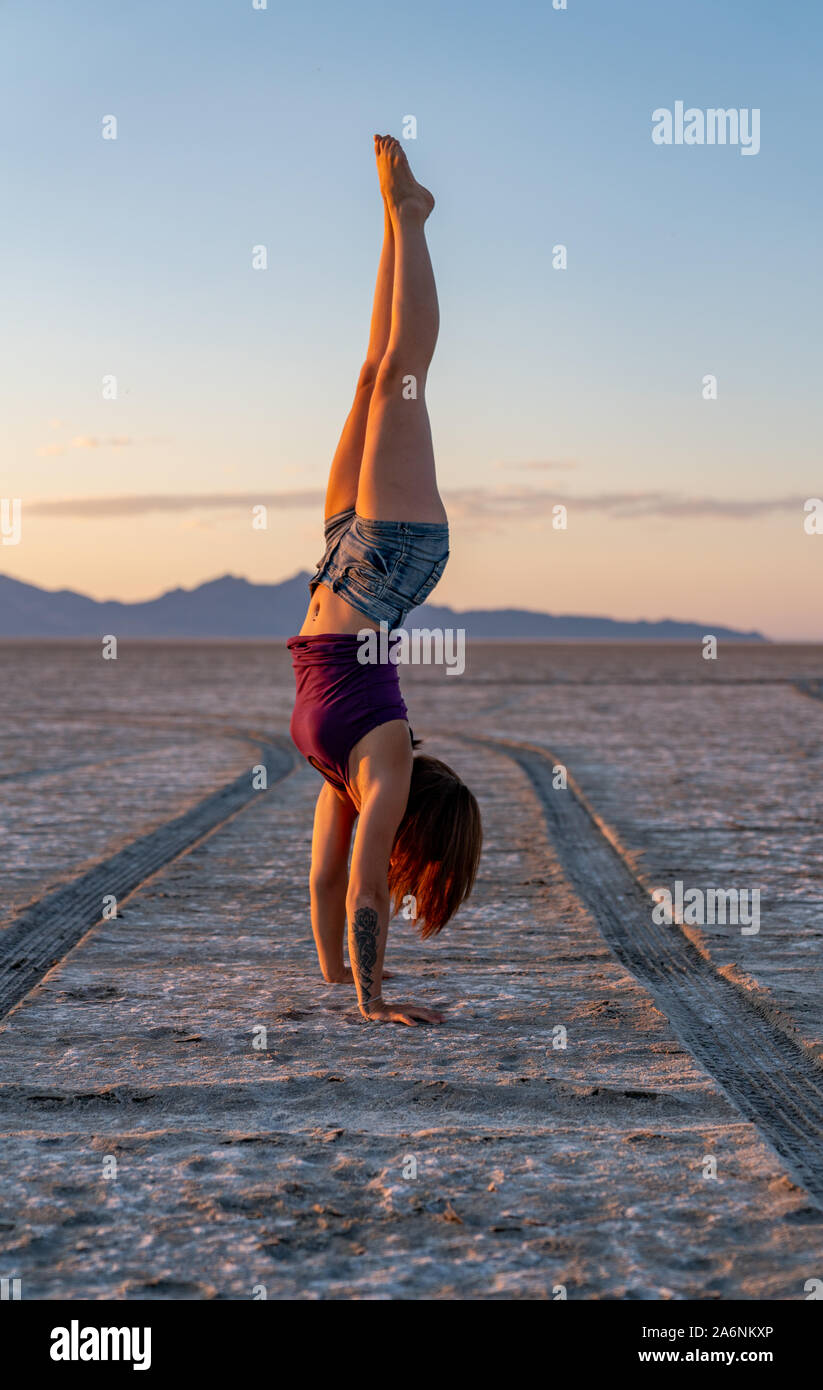 Beautiful Woman Doing Handstands During Sunset in Bonneville Salt flats ...