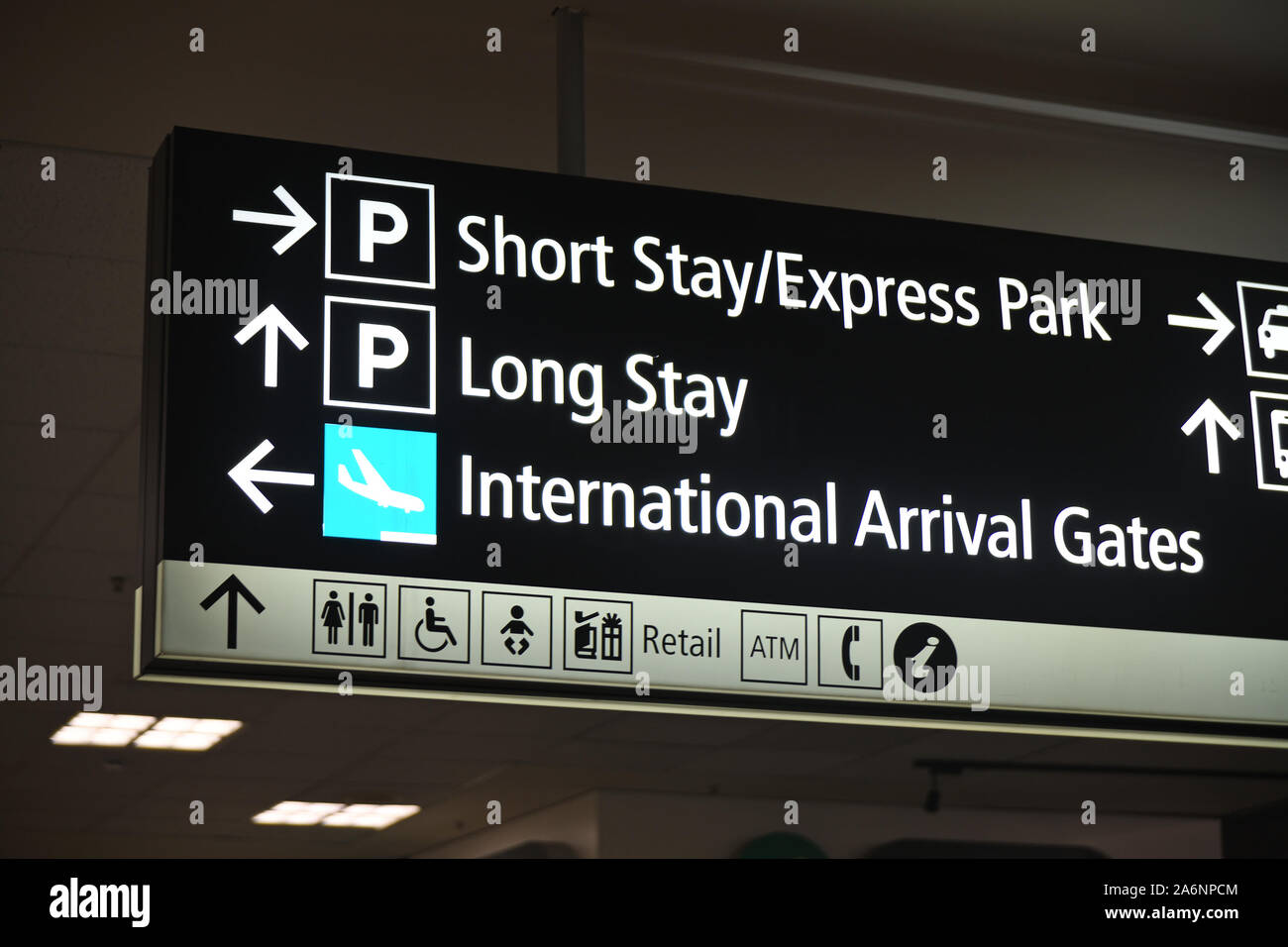 airport signage directing passengers to parking areas and domestic ...