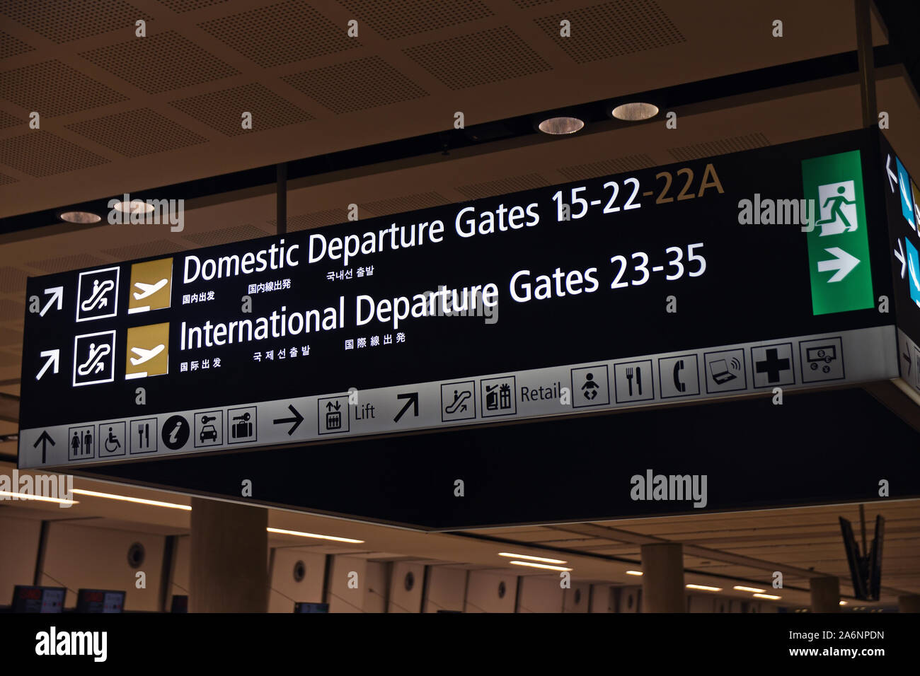 airport signage directing passengers on international and domestic ...