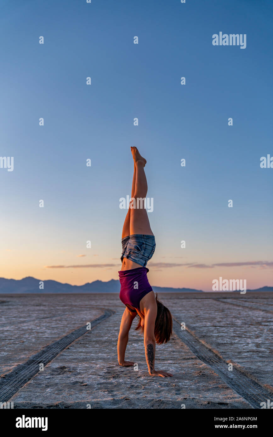 Beautiful Woman Doing Handstands During Sunset in Bonneville Salt flats ...