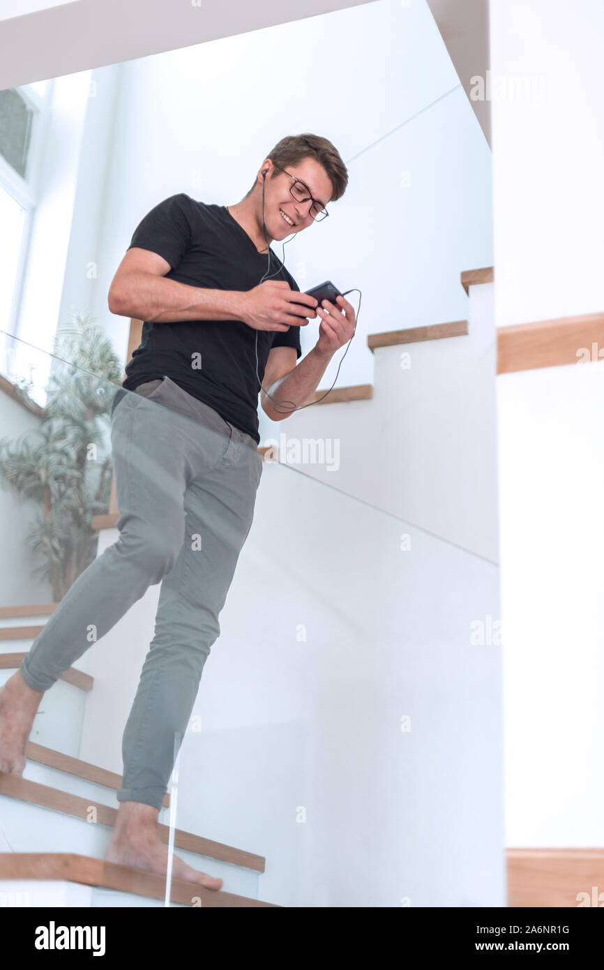 Man walking up apartment stairs hi-res stock photography and images - Alamy