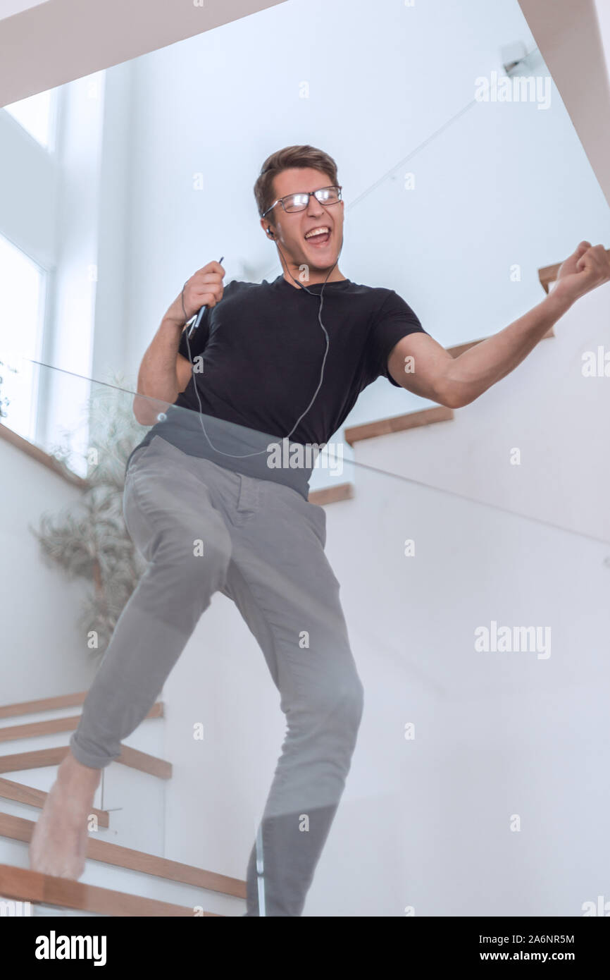 Guy listening music dancing walking hi-res stock photography and images ...