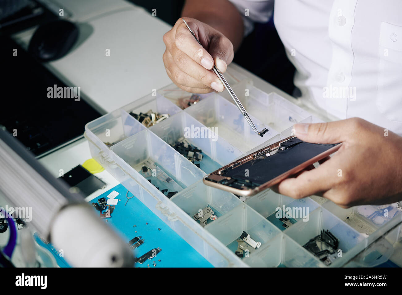 Human hands taking fixing hi-res stock photography and images - Alamy