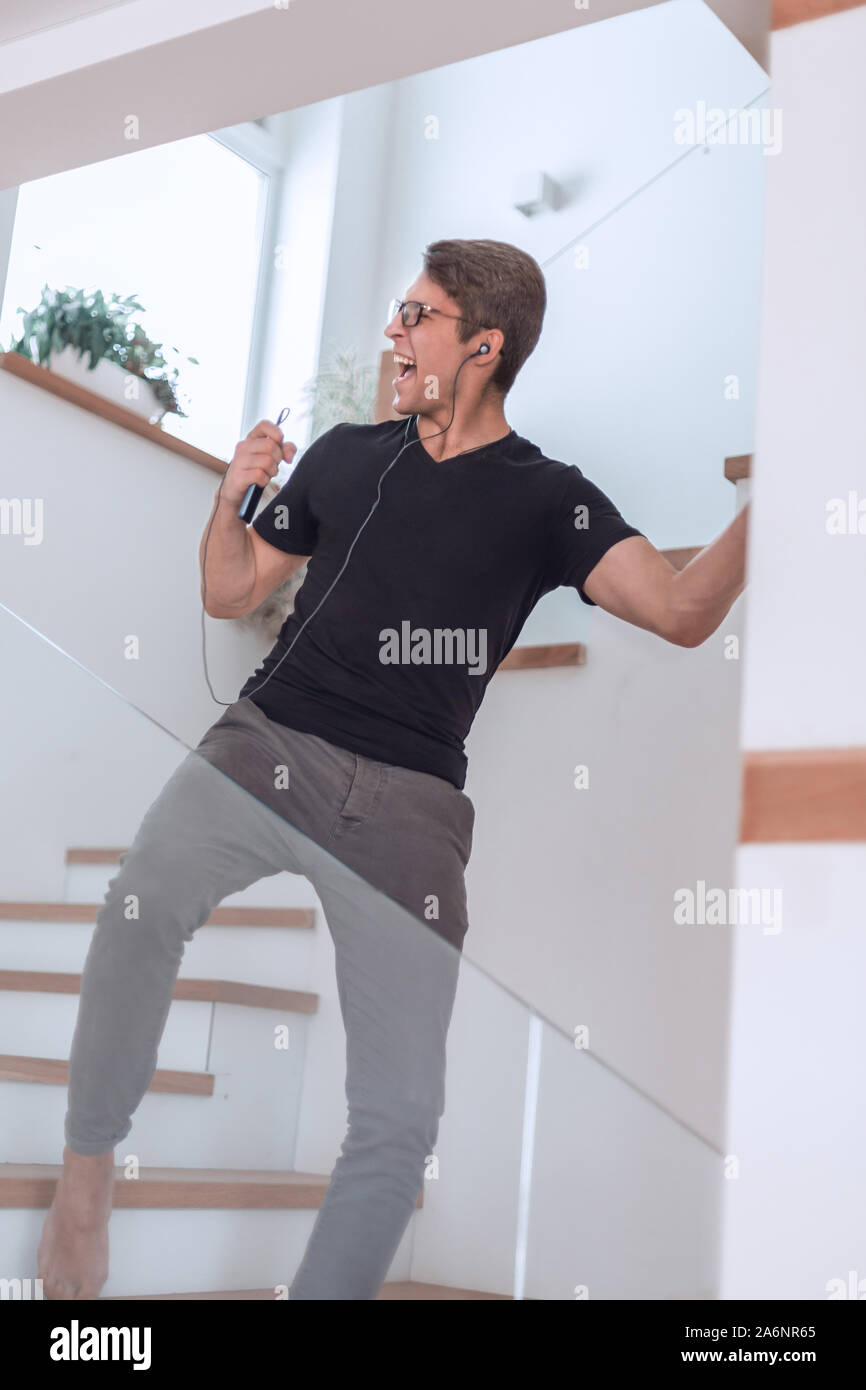 Guy listening music dancing walking hi-res stock photography and images ...