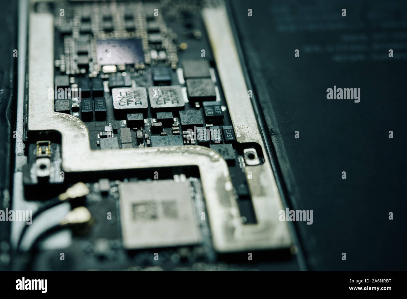 Detail close-up image of smartphone logic panel with system components ...