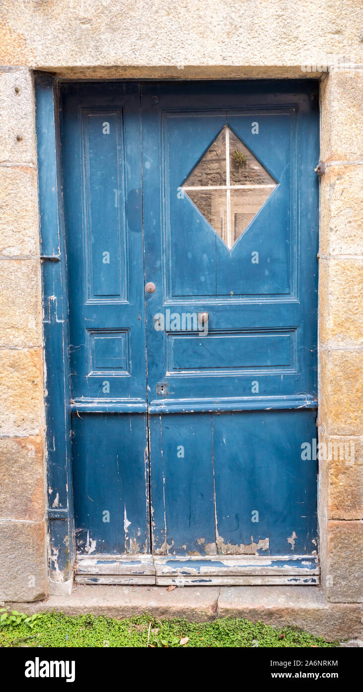 Old blue french door with old paint and characteristic lozenge window ...