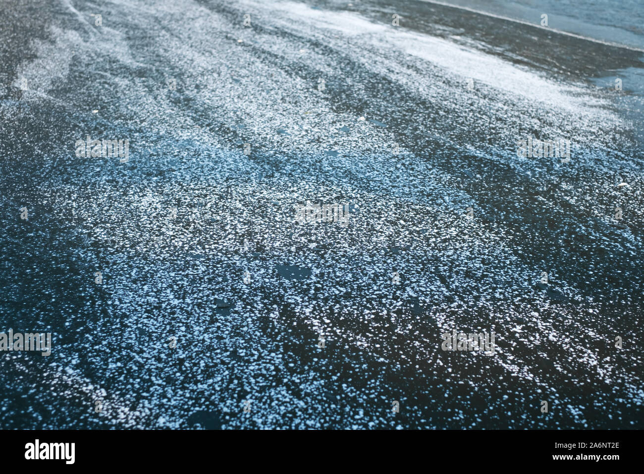 frozen lake with snow flakes Stock Photo - Alamy