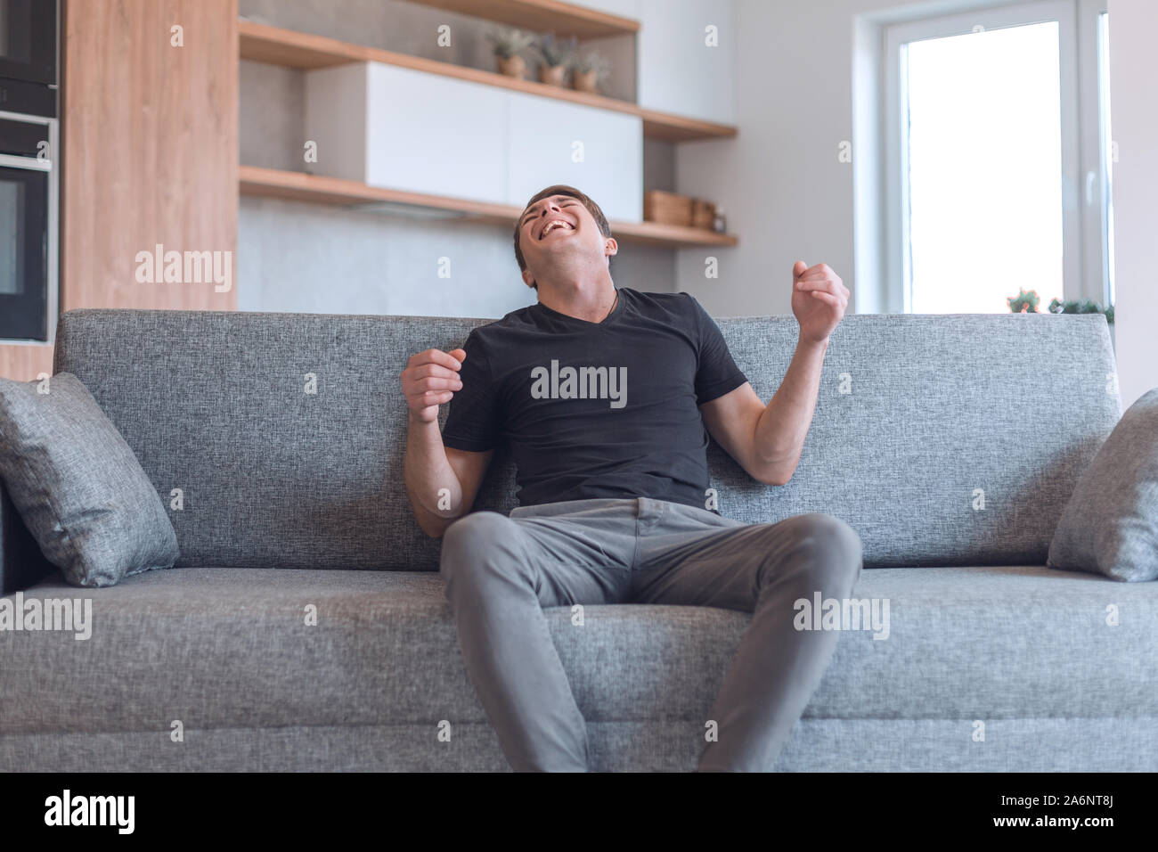 Young Guy Sitting Home Barefoot High Resolution Stock Photography and ...