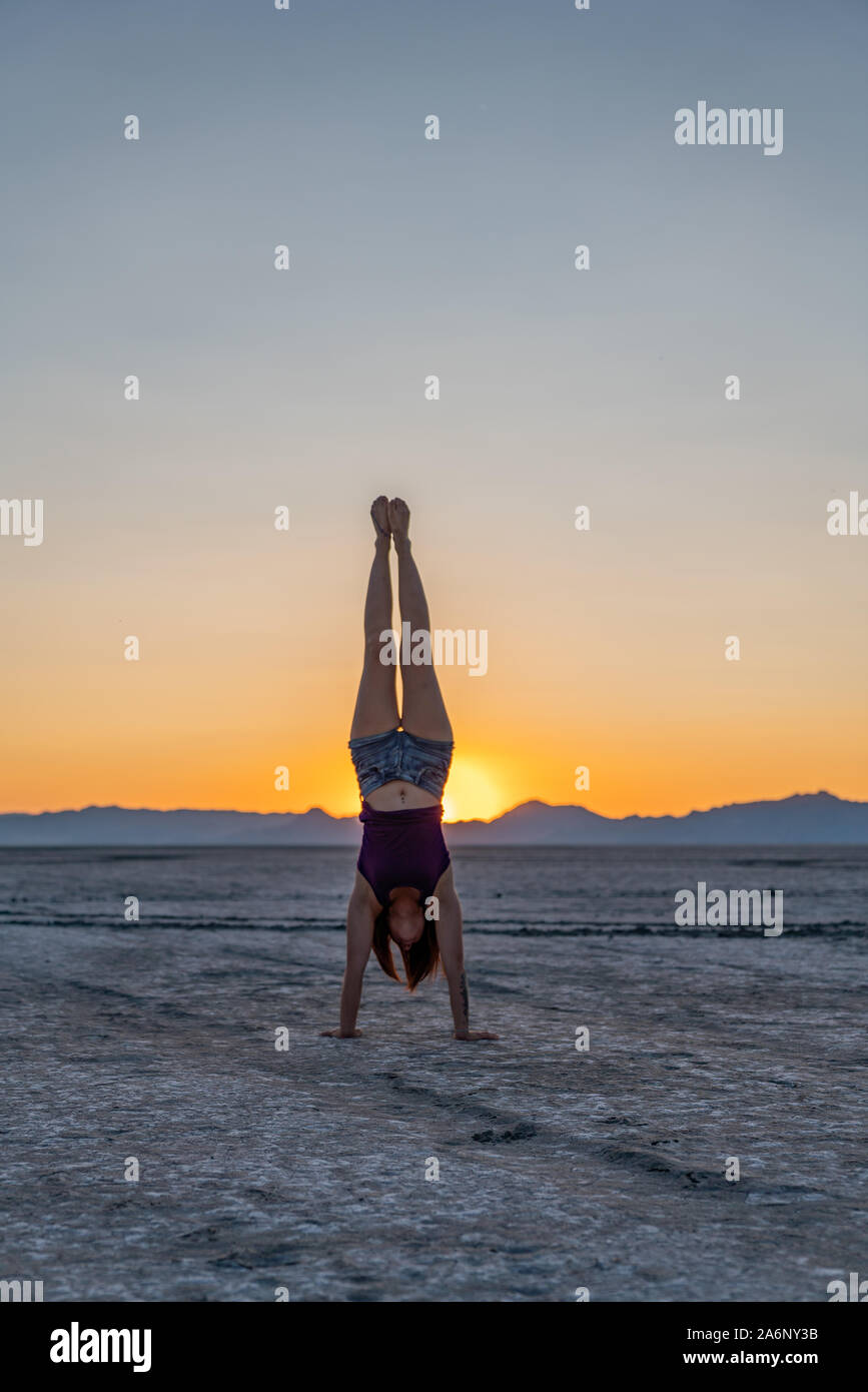Beautiful Woman Doing Handstands During Sunset in Bonneville Salt flats ...