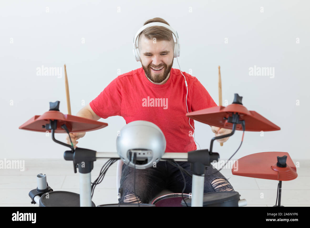 People, music and hobby concept - Man dressed in red t-shirt playing on ...