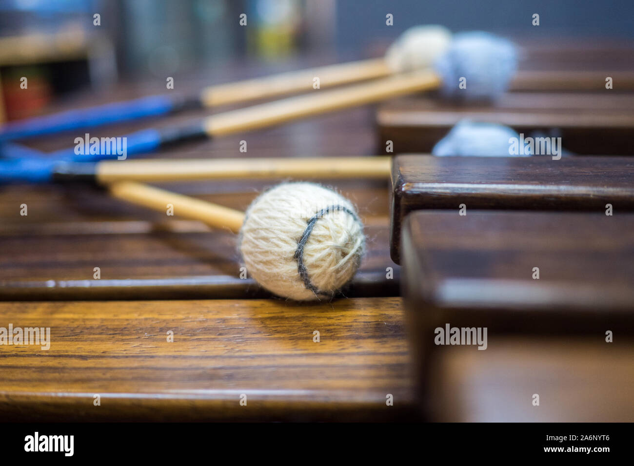 Close shot of a marimba drumstick on the instrument, this big wooden ...