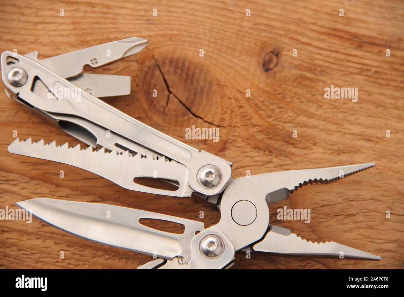 a multitool on the workbench Stock Photo - Alamy
