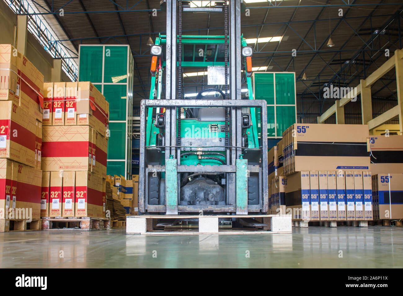 The forklift loading pallet and product cartons Stock Photo - Alamy