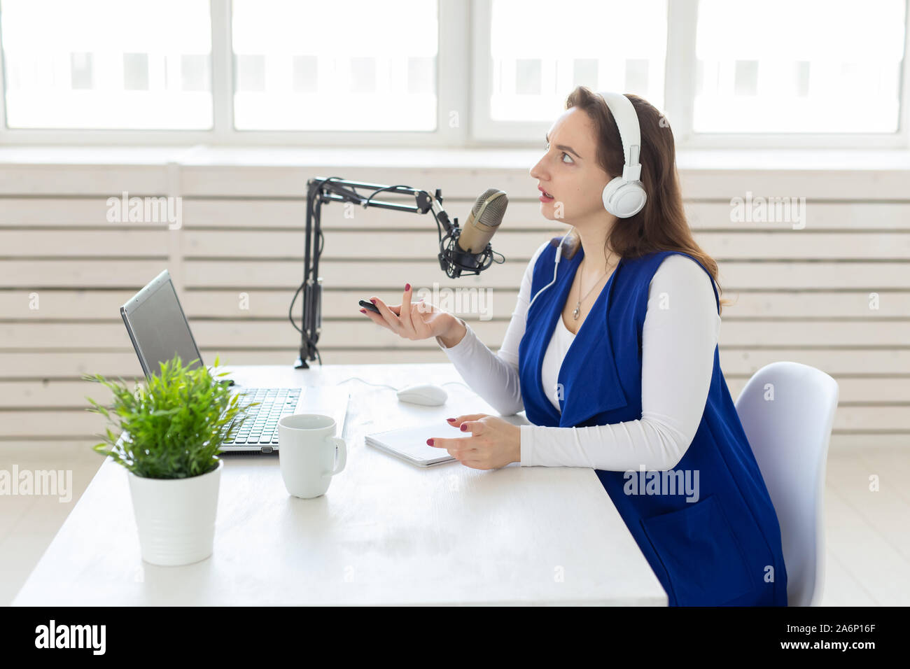 Radio host concept - Portrait of woman radio presenter with headphones ...