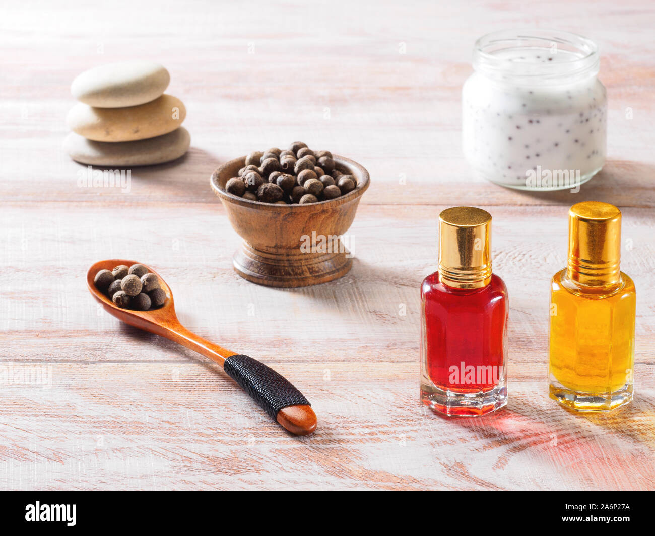 Still life from natural aromatherapy and spa ingredients on a brown ...