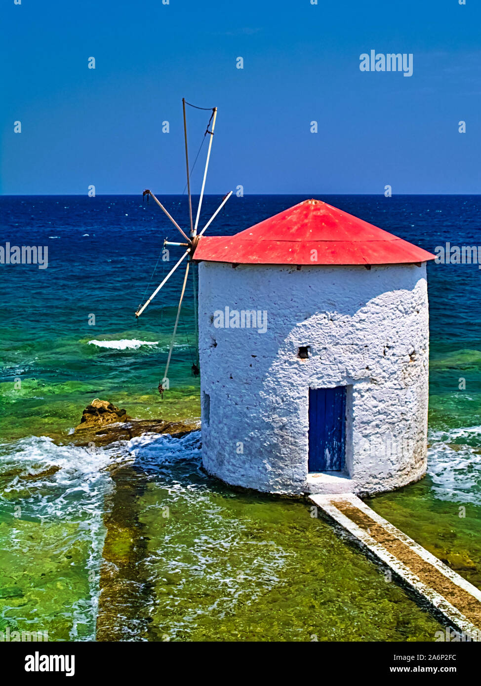 Traditional windmill in the sea. Landmark of Leros island, Greece ...