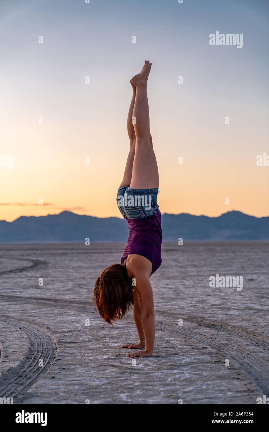 Beautiful Woman Doing Handstands During Sunset in Bonneville Salt flats ...