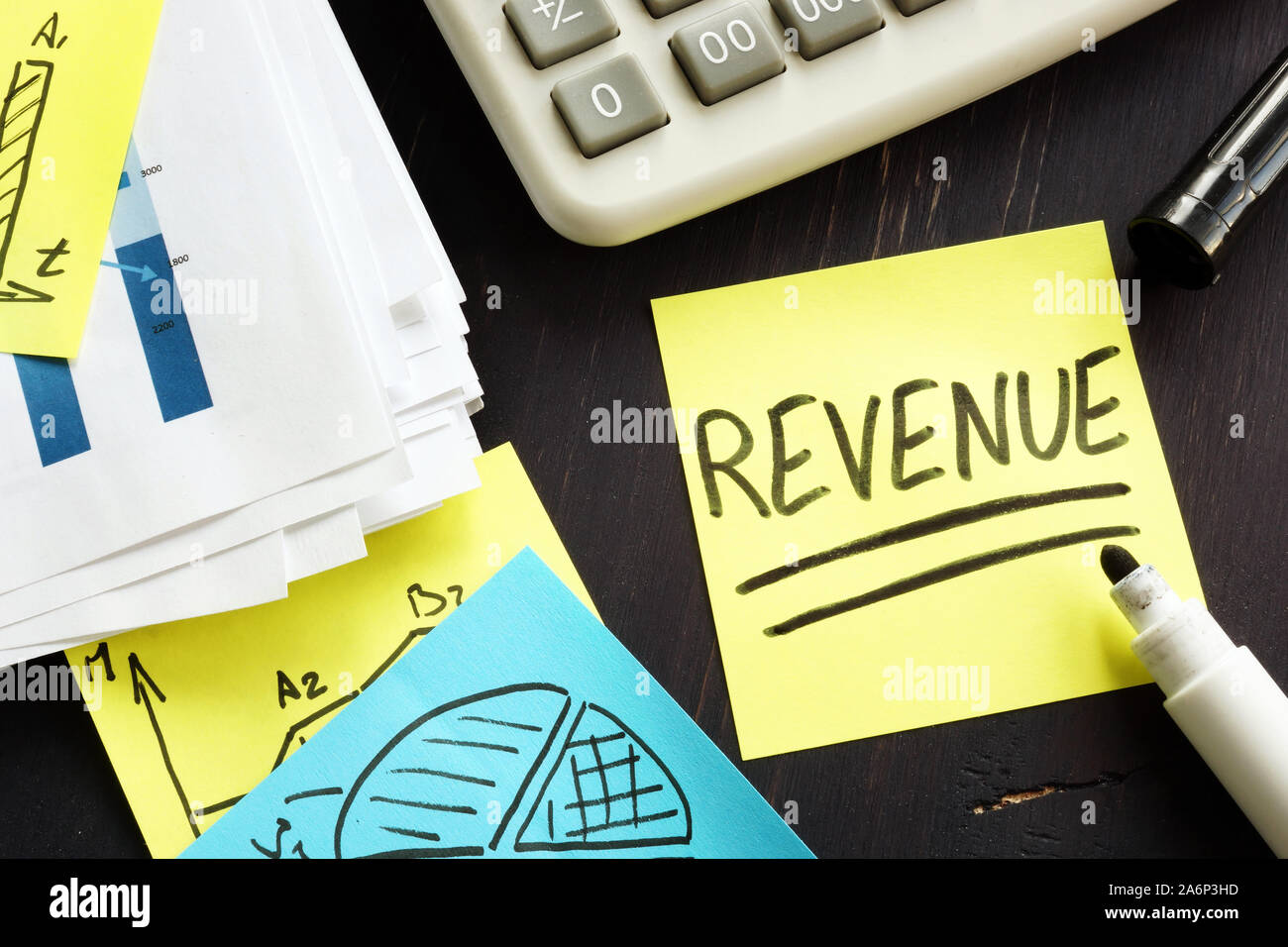 Revenue concept. Desk with stack of accounting documents Stock Photo ...