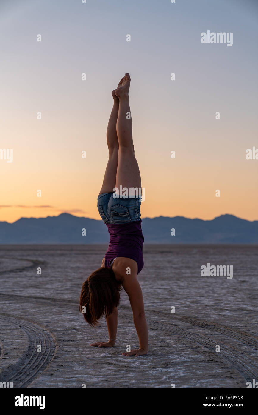 Beautiful Woman Doing Handstands During Sunset in Bonneville Salt flats ...