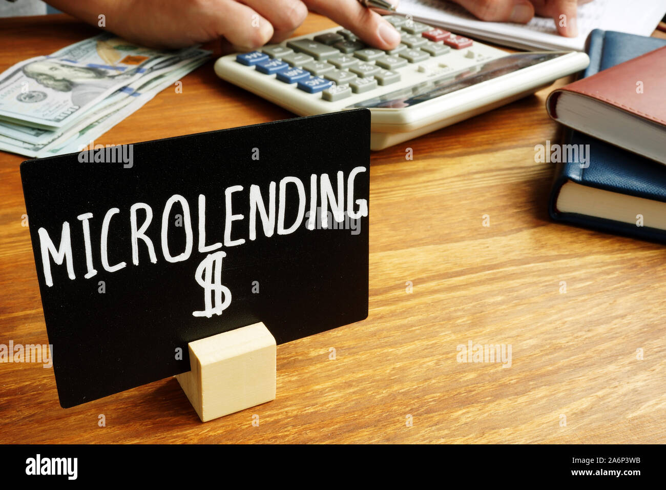 Microlending sign on the black plate. Micro loan concept Stock Photo ...