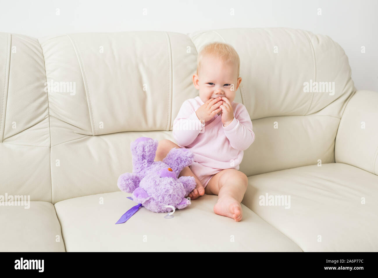 childhood, babyhood and people concept - happy little baby girl sitting ...