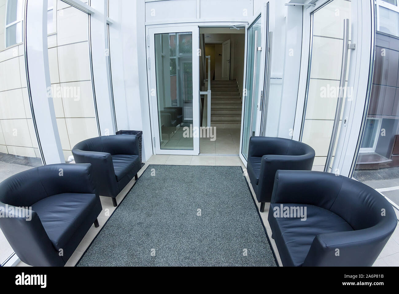 Interior of the medical clinic bright foyer with black chairs Stock ...