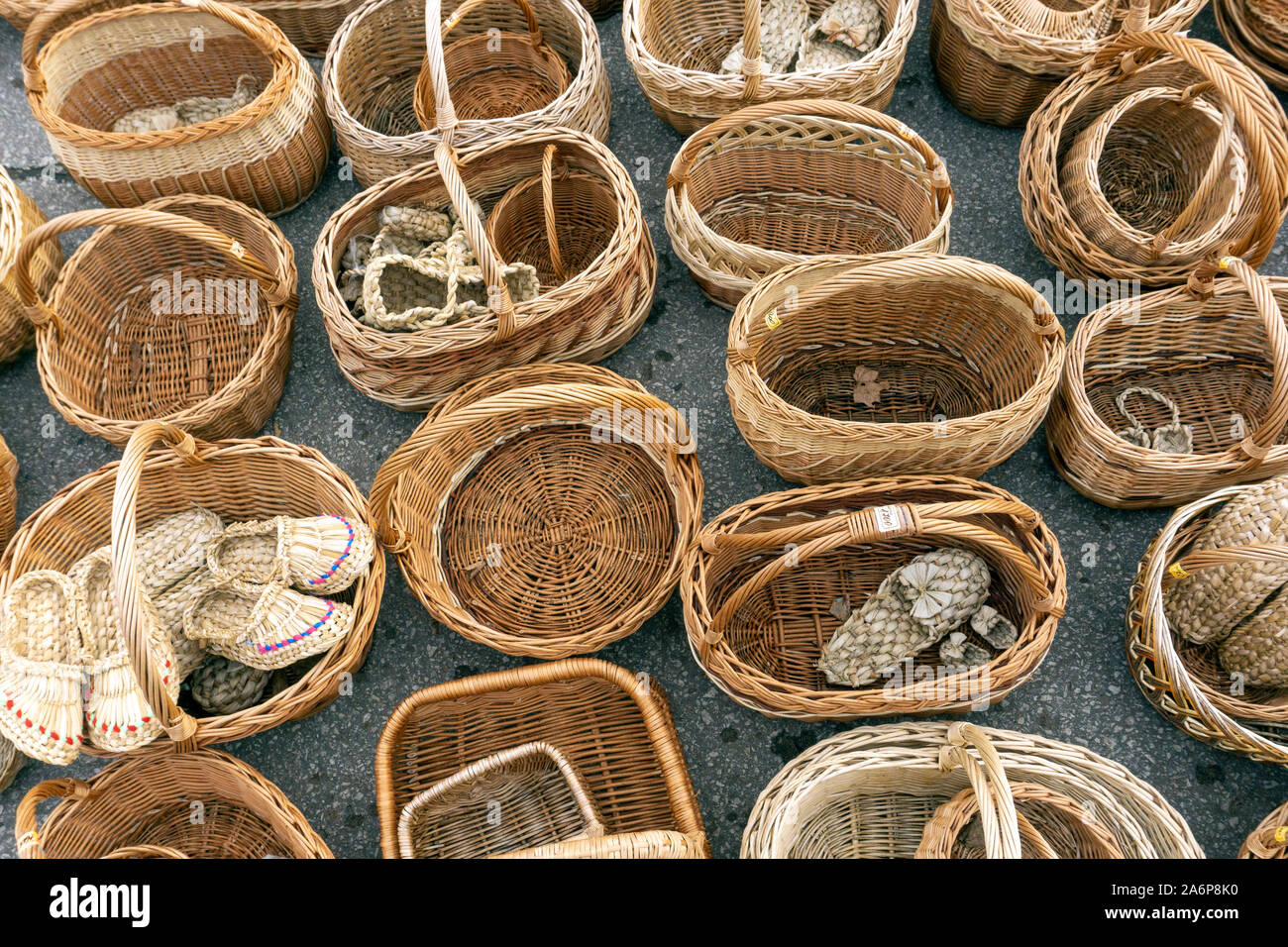 Wicker baskets made of straw. Russian craft and handmade souvenirs ...