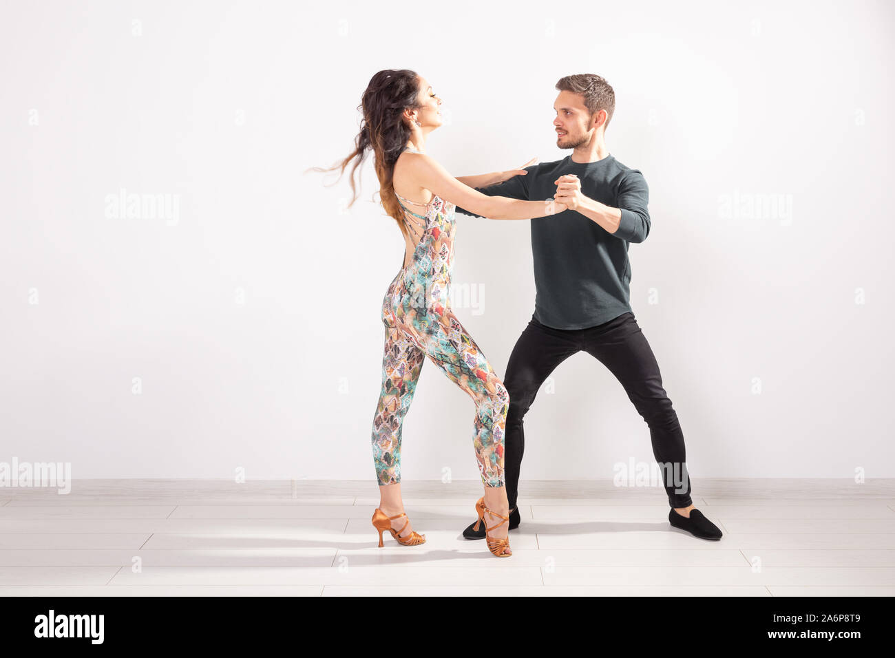 Young love couple dancing social danse kizomba or bachata over white ...