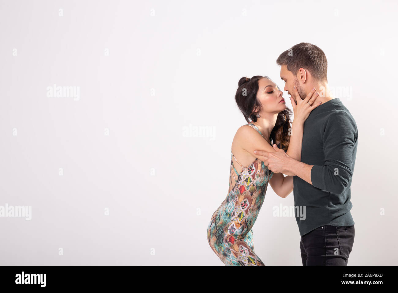 Young love couple dancing social danse kizomba or bachata over white ...