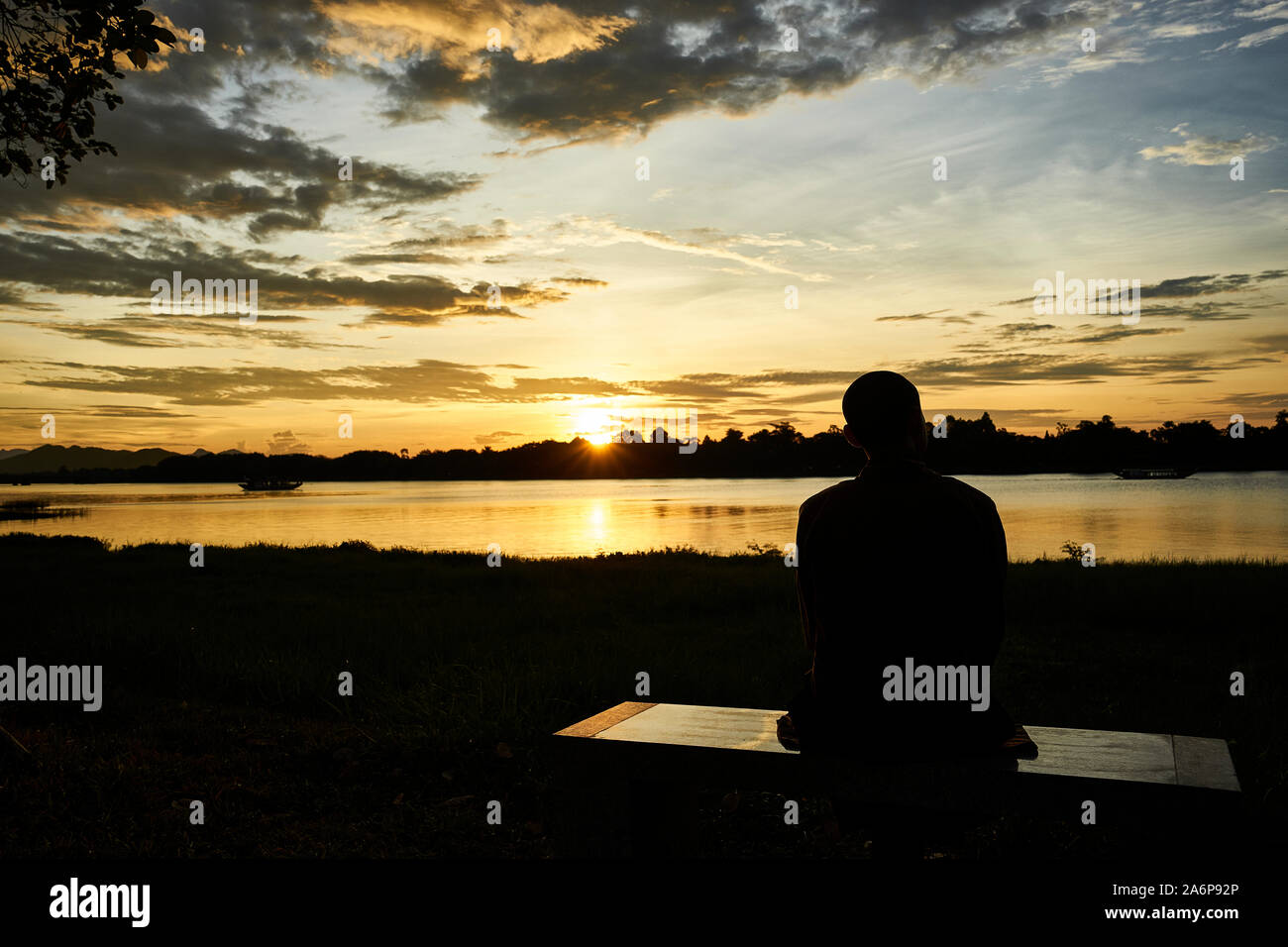 Vietnamese monk at sunset Stock Photo - Alamy