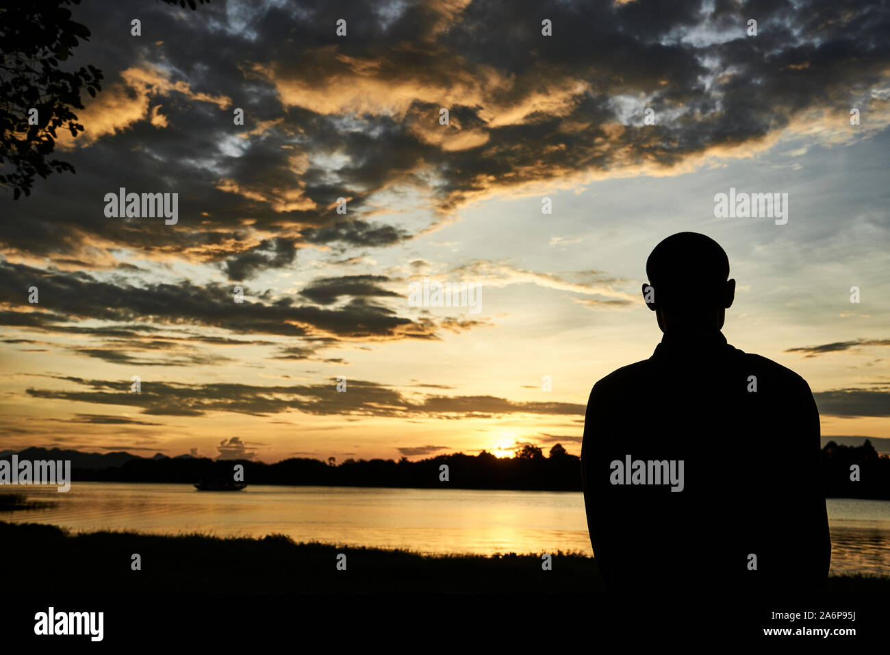 Vietnamese monk at sunset Stock Photo - Alamy