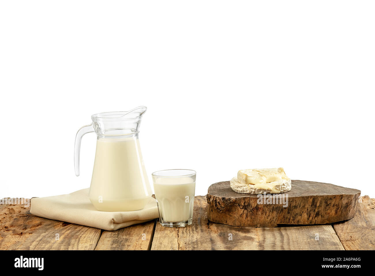 Different milk products, cheese, cream, milk on wooden table and white ...