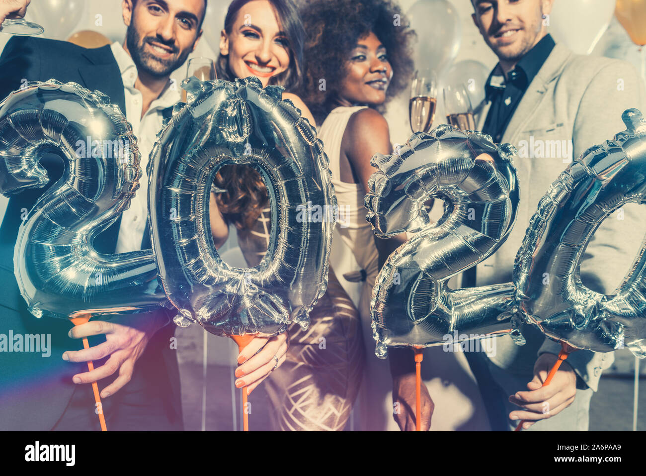Group of party people celebrating the arrival of 2020 Stock Photo - Alamy
