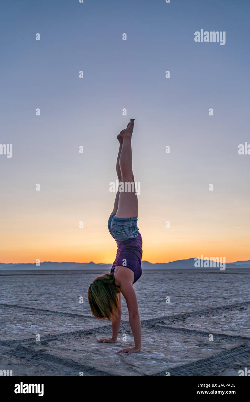 Beautiful Woman Doing Handstands During Sunset in Bonneville Salt flats ...