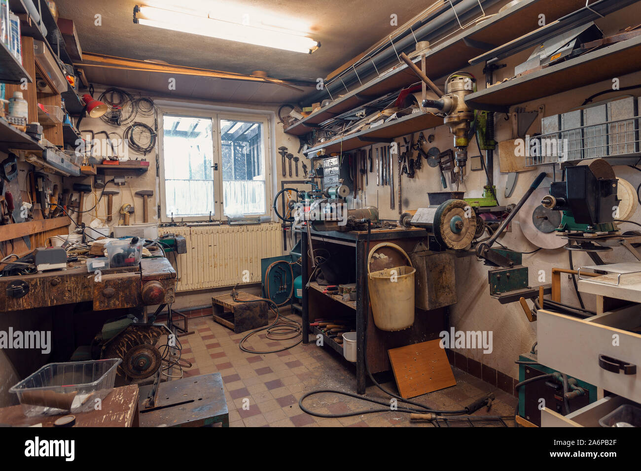 home workshop with all necessary tools for DIY, untidy, ready for work ...