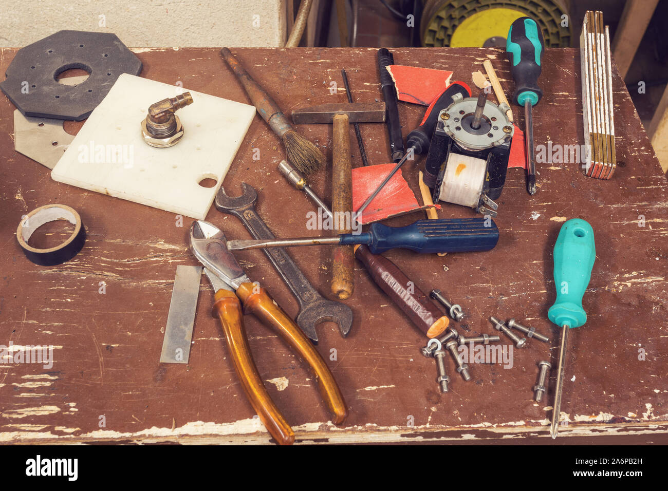 tools on table in workshop room, untidy, ready for work Stock Photo - Alamy