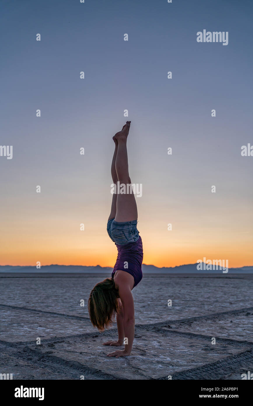 Beautiful Woman Doing Handstands During Sunset in Bonneville Salt flats ...