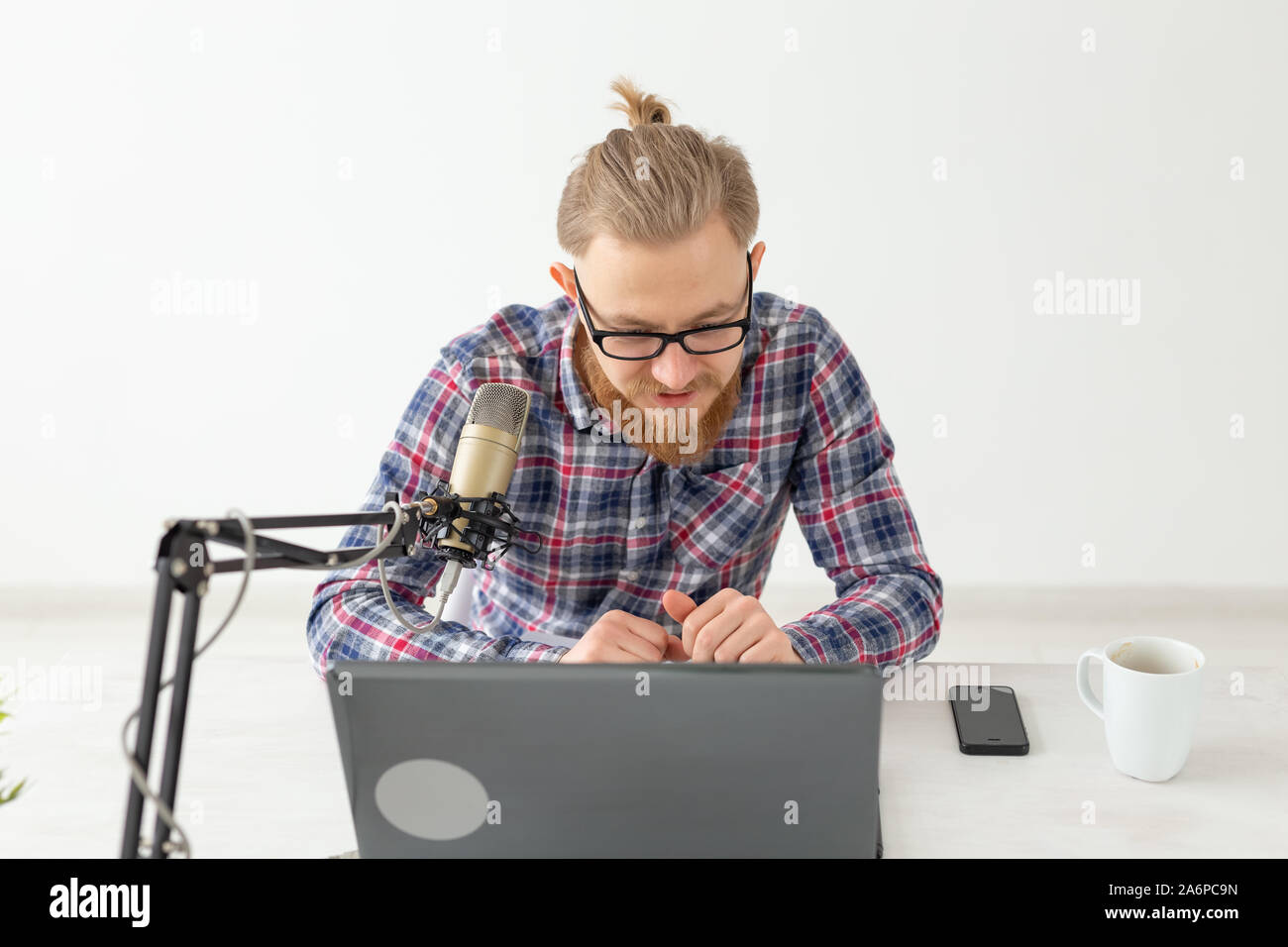 Radio host concept - Handsome man working as radio host at radio ...