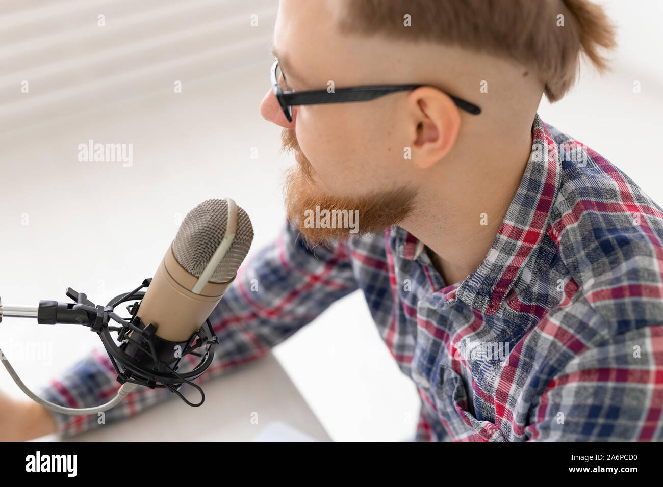 Radio host concept - Close-up of handsome man working as radio host at ...