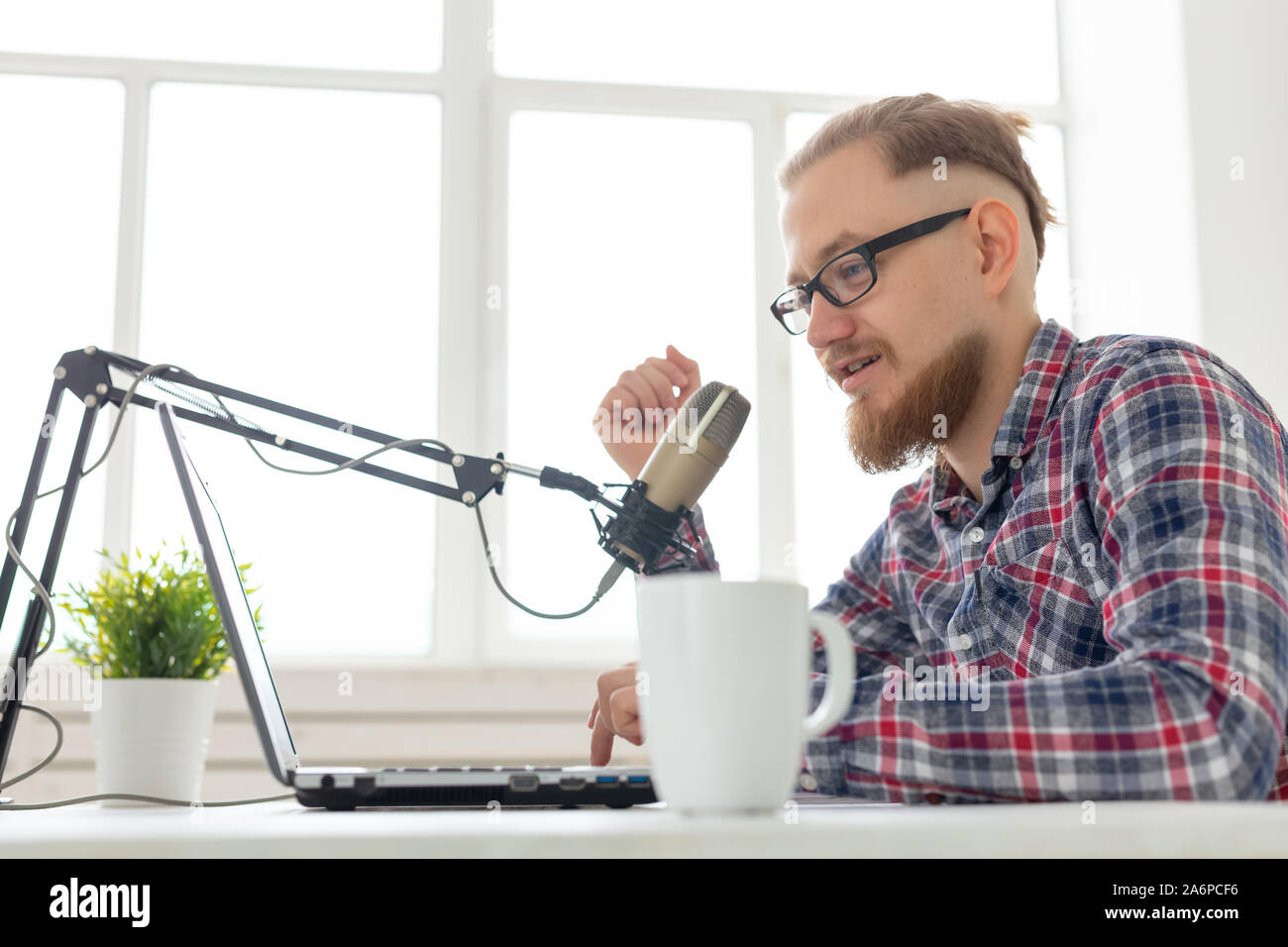 Radio host concept - Close-up of handsome man working as radio host at ...
