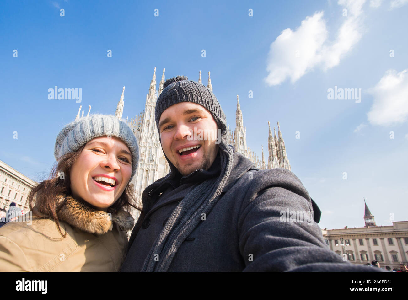 Couple taking self portrait in Duomo square in Milan. Traveling and ...