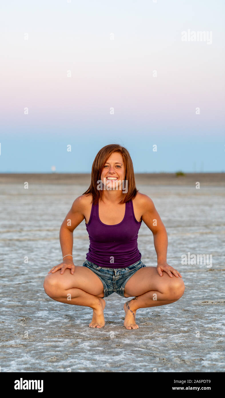 Beautiful Woman Doing Handstands During Sunset in Bonneville Salt flats ...